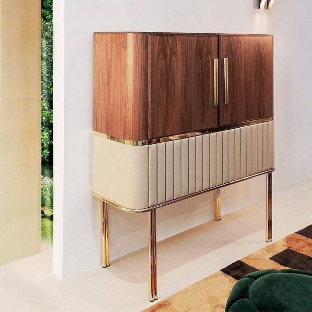 With a body handmade in walnut and two door handles made of polished ...